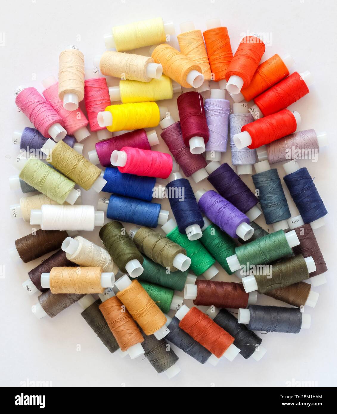 A messy stack of colorful threads on a white background Stock Photo - Alamy