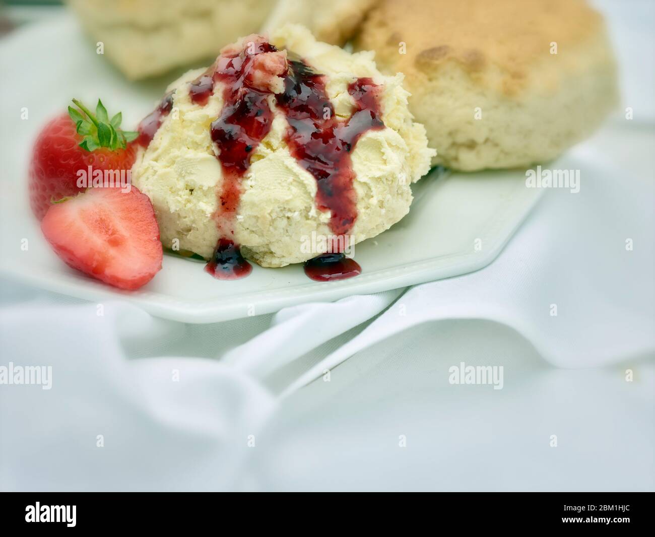 British cream tea, scones with clotted cream, strawberry jam and ...