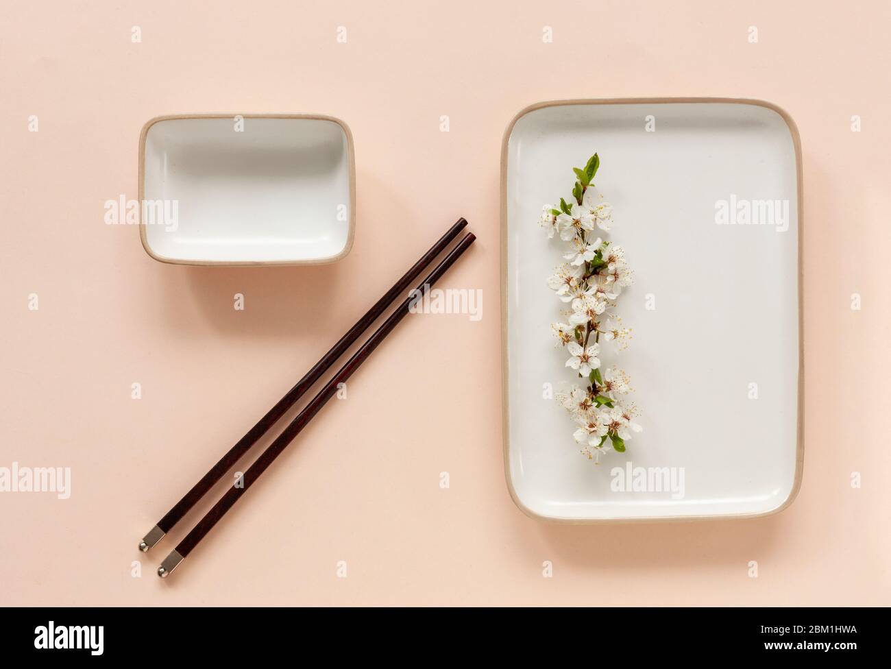Spring floral Japanese food concept with blooming cherry tree branches ...