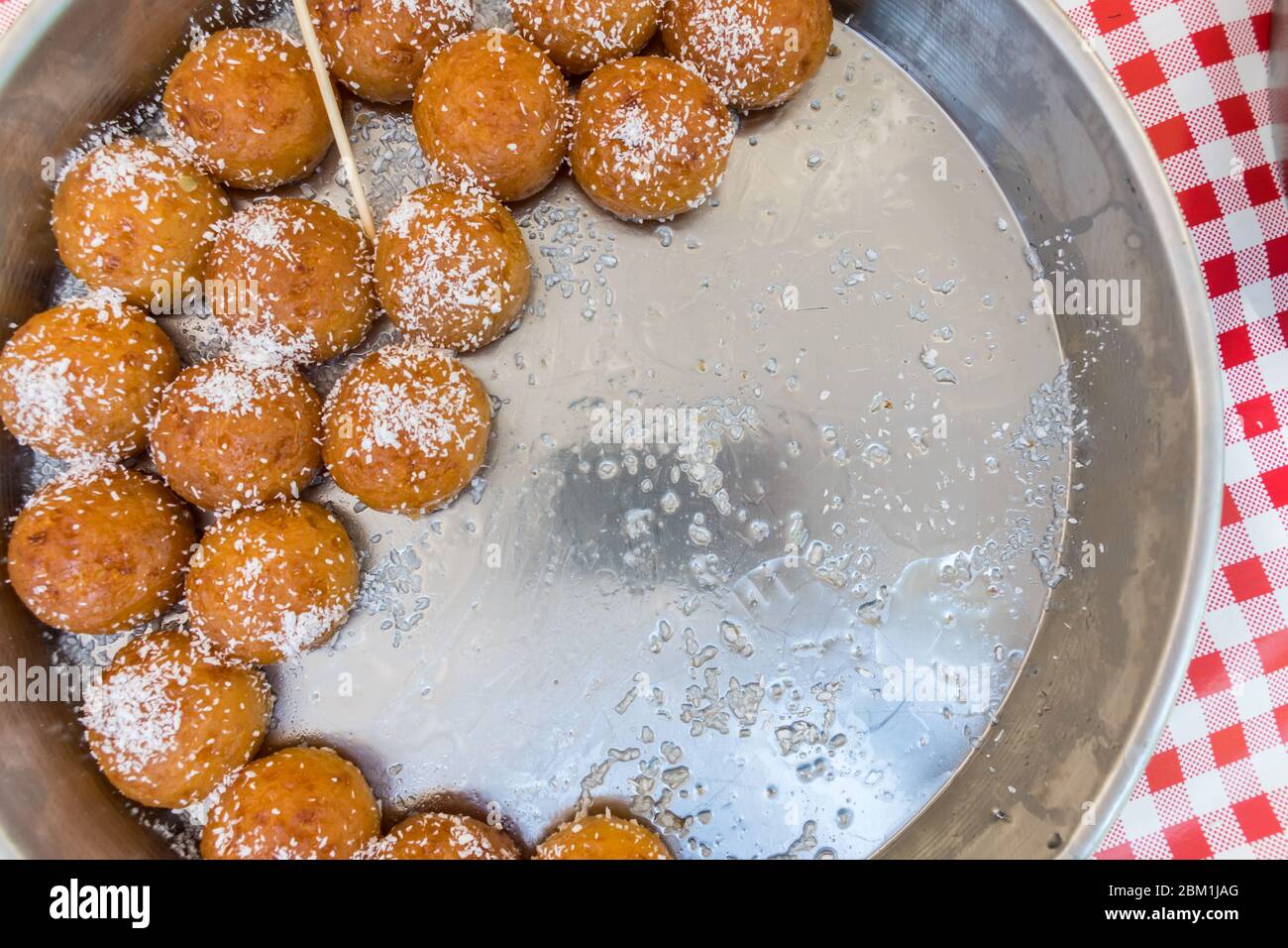 Lokma, Turkish street food dessert. Bites flavoured with honey, sugar ...
