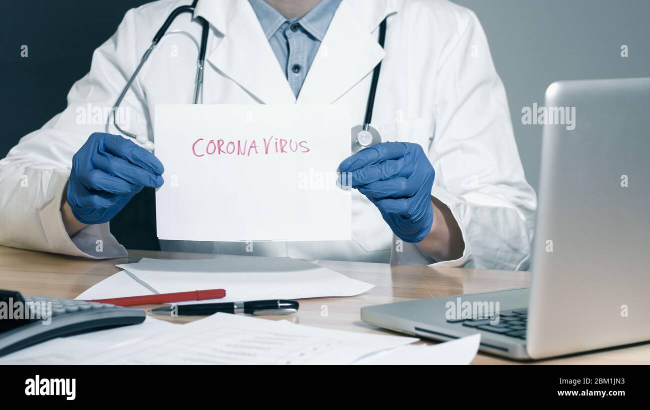 Doctor checking for antibody immunity test and writing Coronavirus on ...