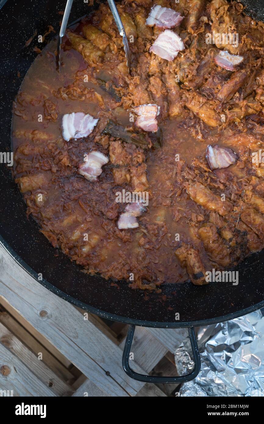 Cooking stew campfire concept, stew preparing open grill steaming ...