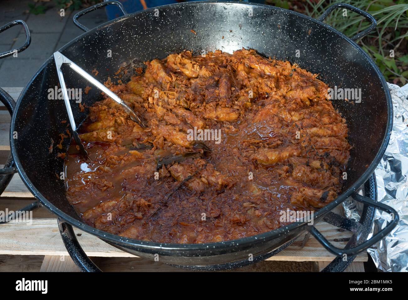 Cooking stew campfire concept, stew preparing open grill steaming ...