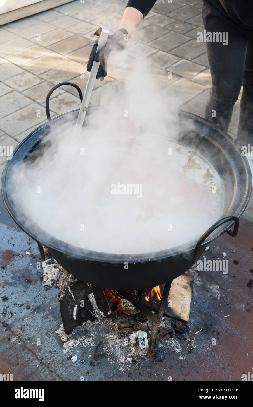 Cooking pot over campfire, stew preparing open grill steaming. Outdoor ...