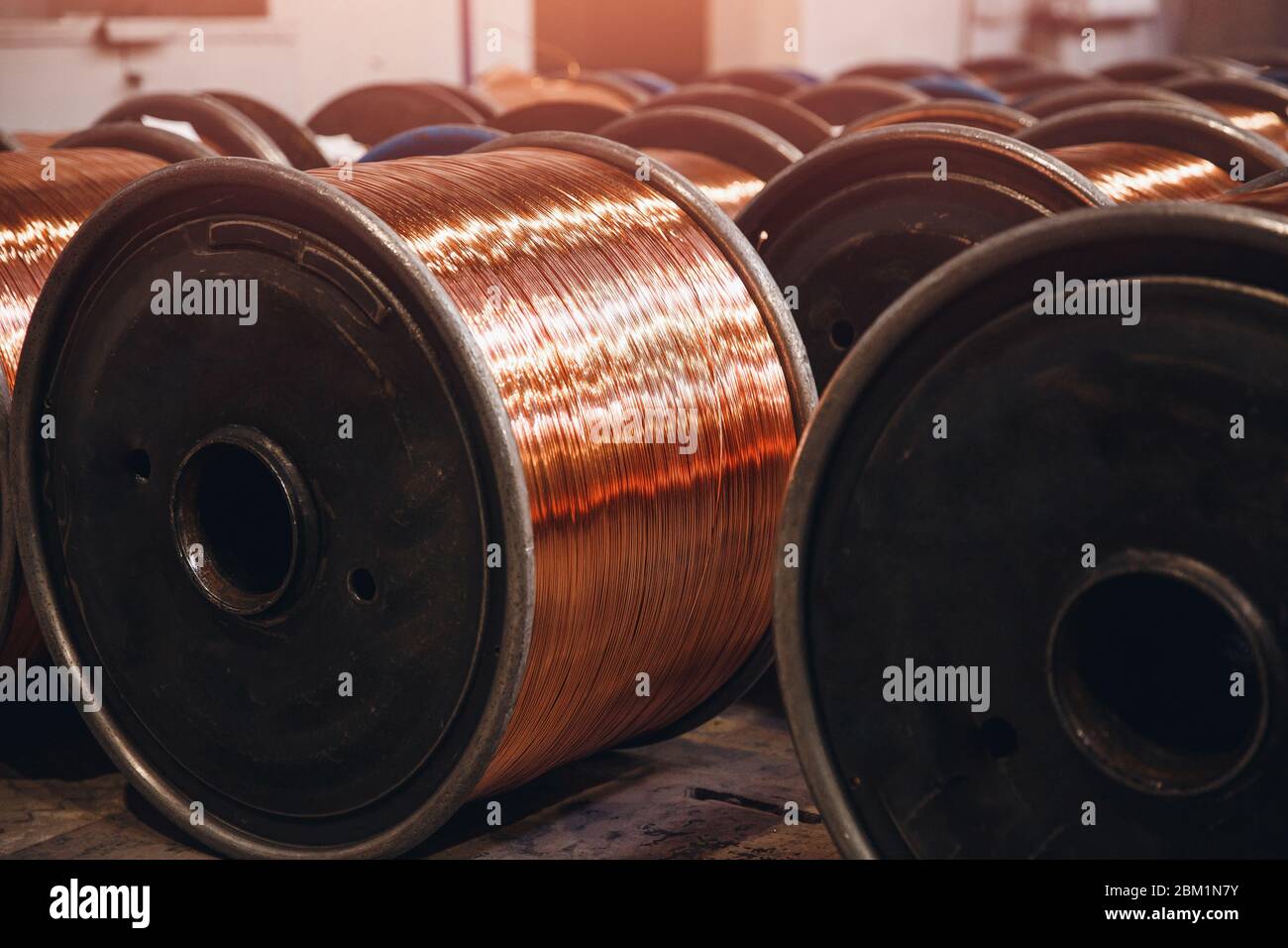 Production of copper wire, bronze cable in reels at factory Stock Photo ...