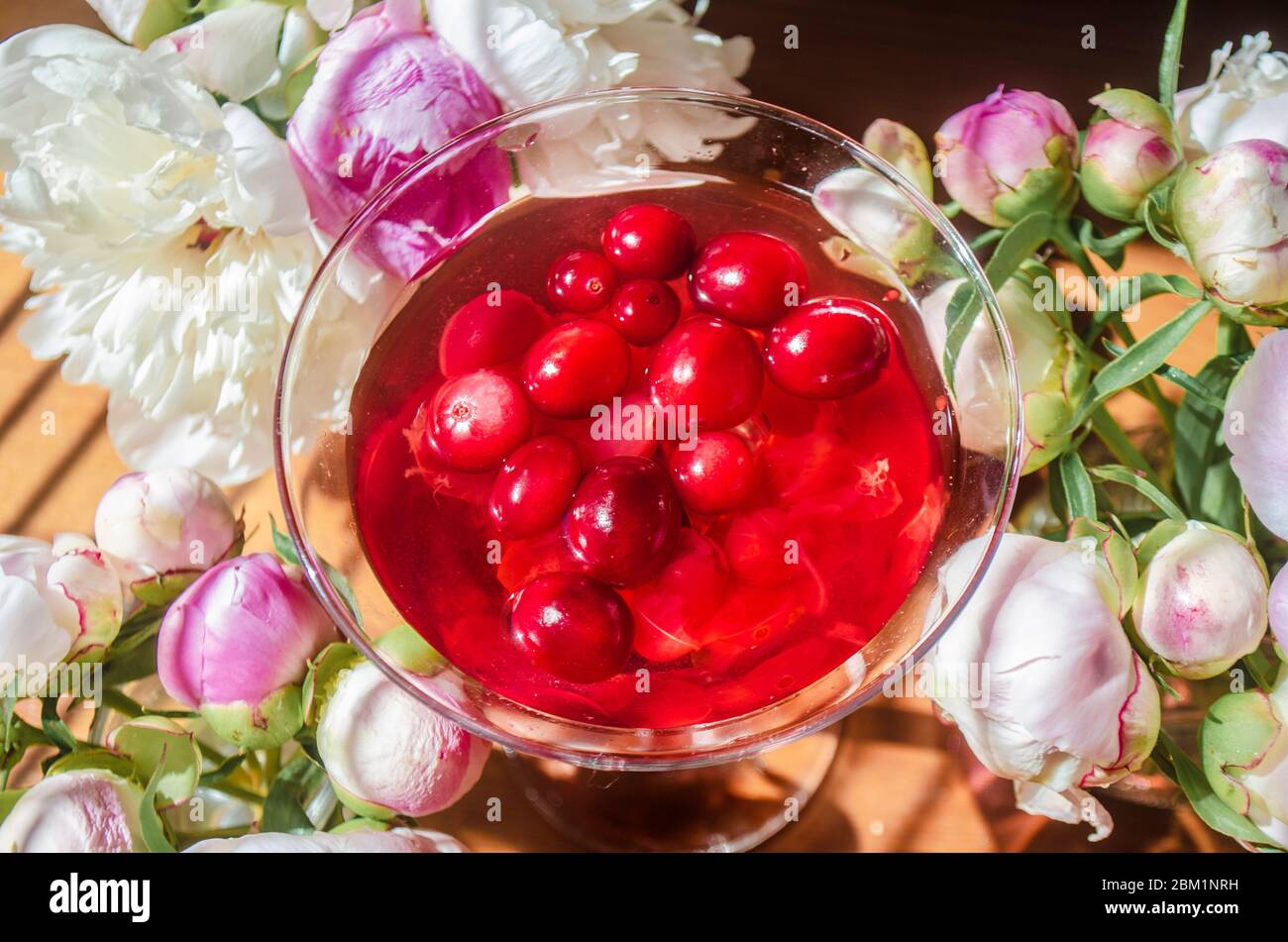 Magic solemn still life with glass of red drink with autumn organic ...