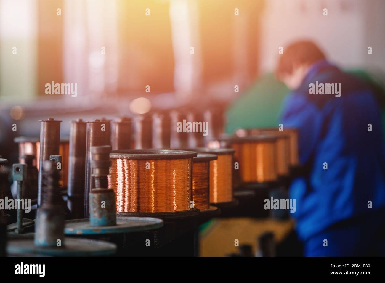 Production of copper wire, bronze cable in reels at factory Stock Photo ...