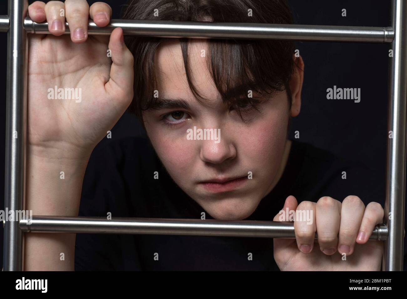 child in a cage, the concept of restriction of freedom and violation of ...