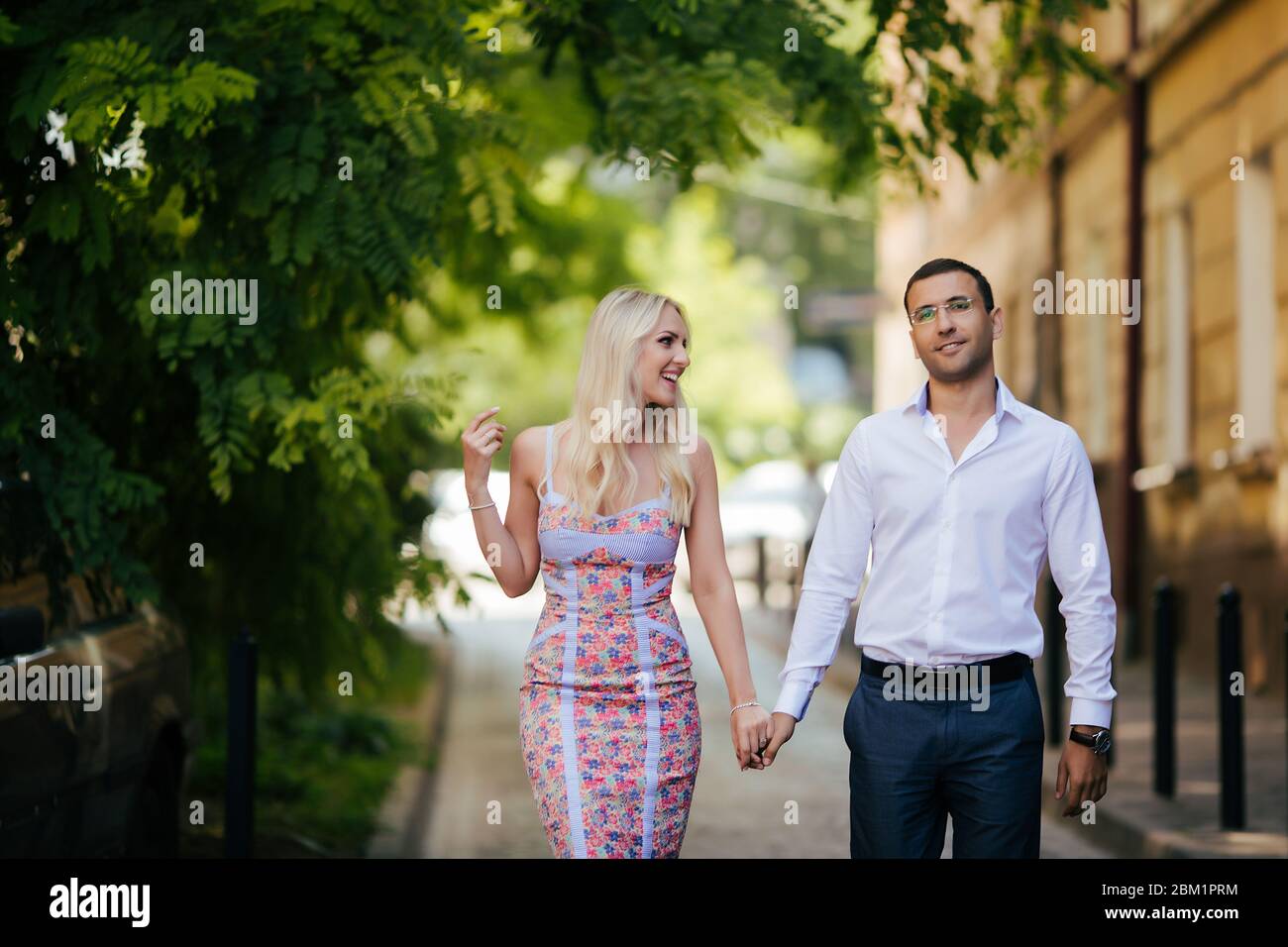 Romantic tourist couple walking around the city relaxing Stock Photo ...