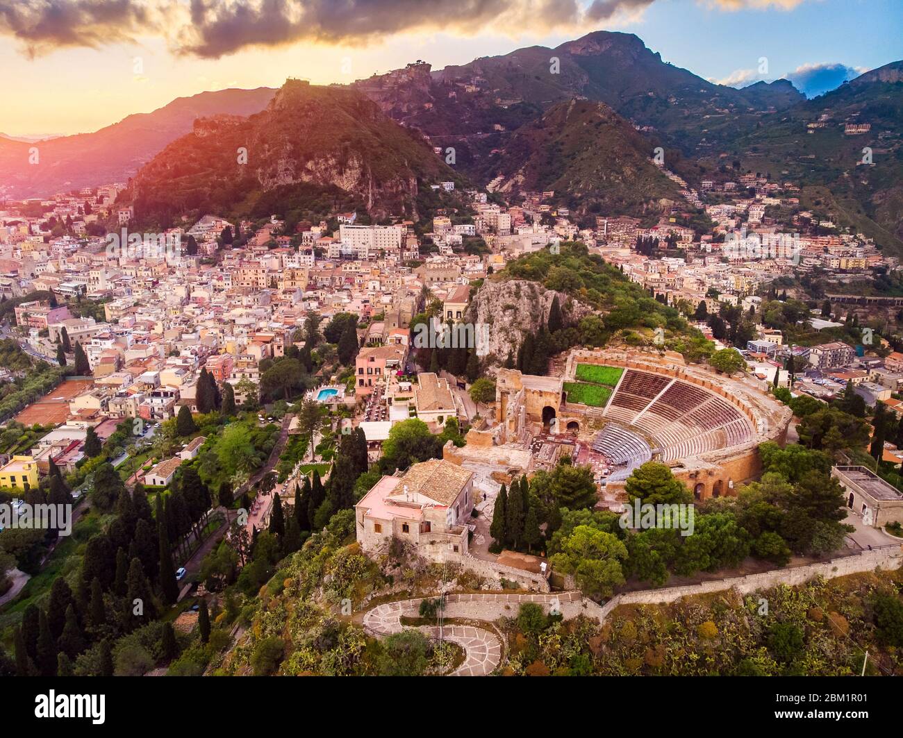 Taormina ruins of theater, Sicily Italy sunset, volcano Etna in clouds ...