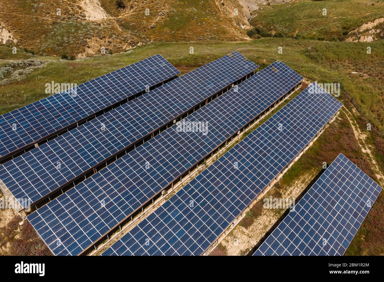 Solar energy farm of panels installed in field, power of remote ...