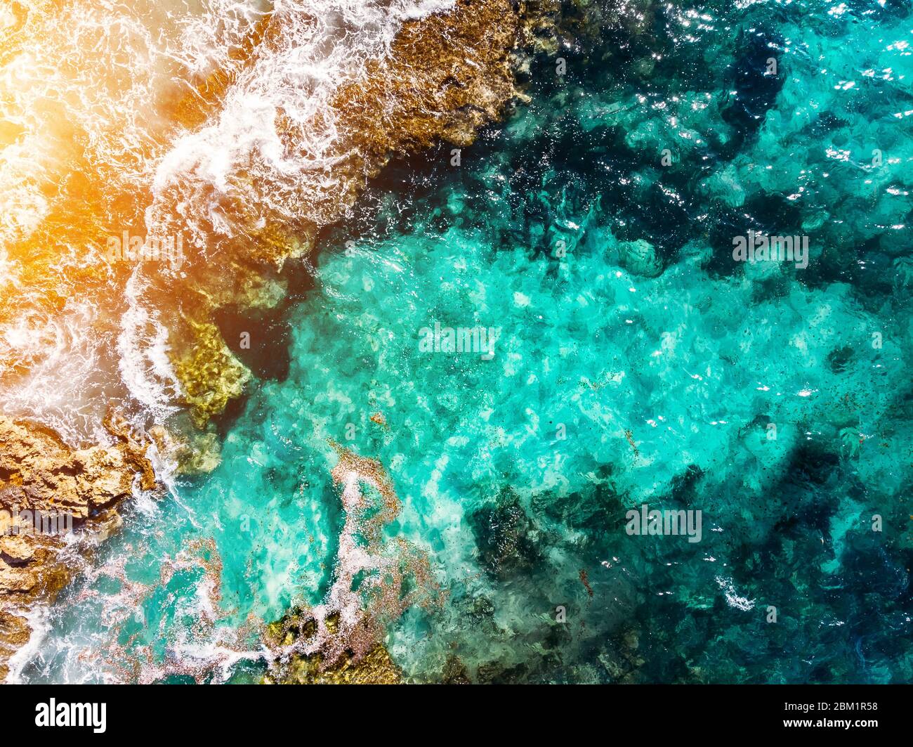 Blue sea coast on island, top view aerial Stock Photo - Alamy
