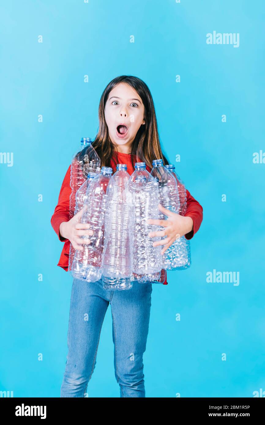 Girl recycling plastic bottles hi-res stock photography and images - Alamy