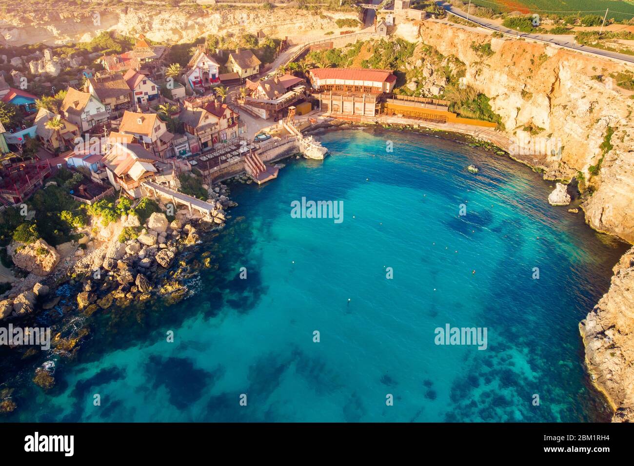 Village Popeye bay panorama Malta sunset. Aerial top view Stock Photo ...
