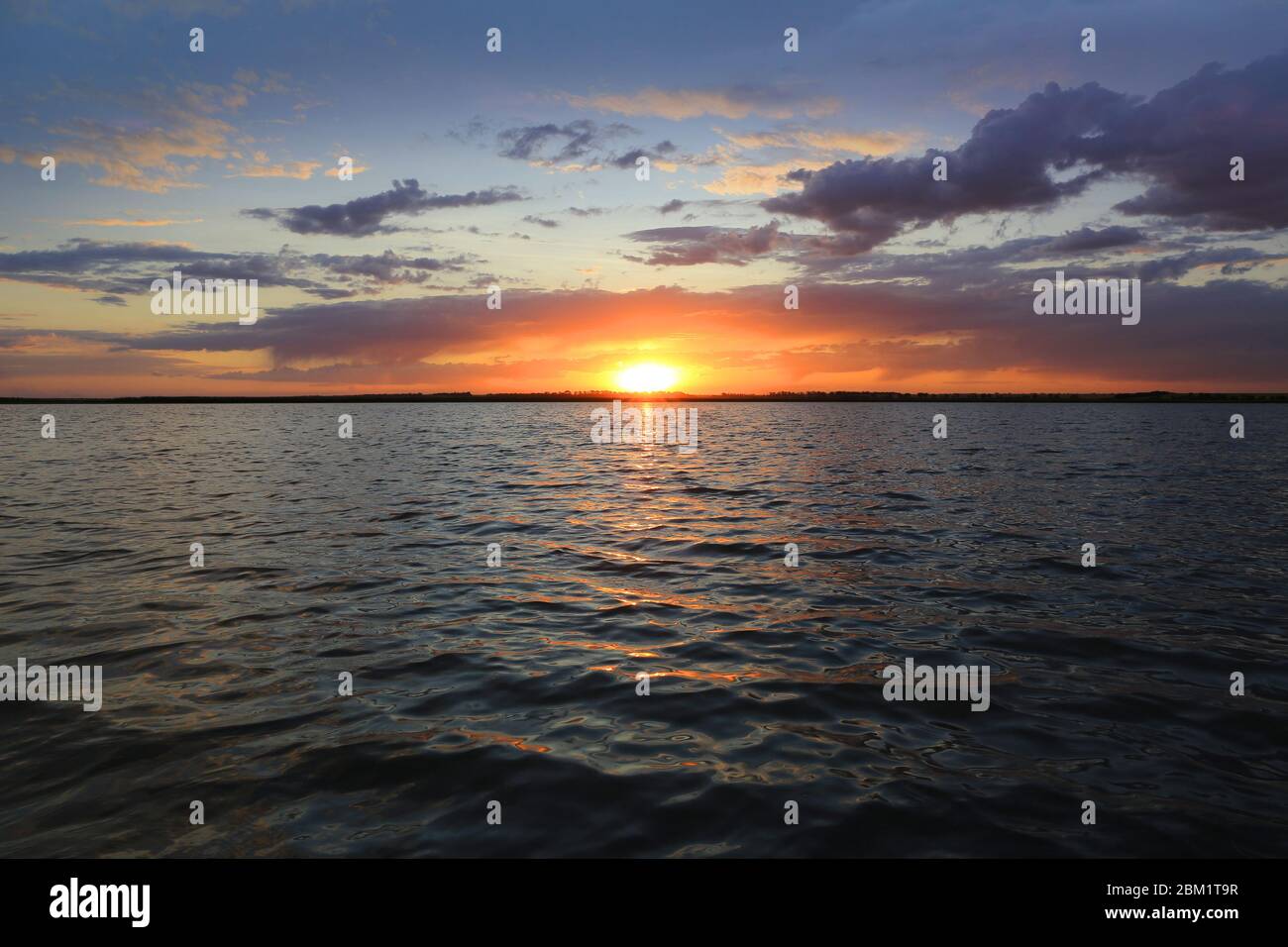 Nice sunset scene on lake. Summer evening landscape Stock Photo - Alamy
