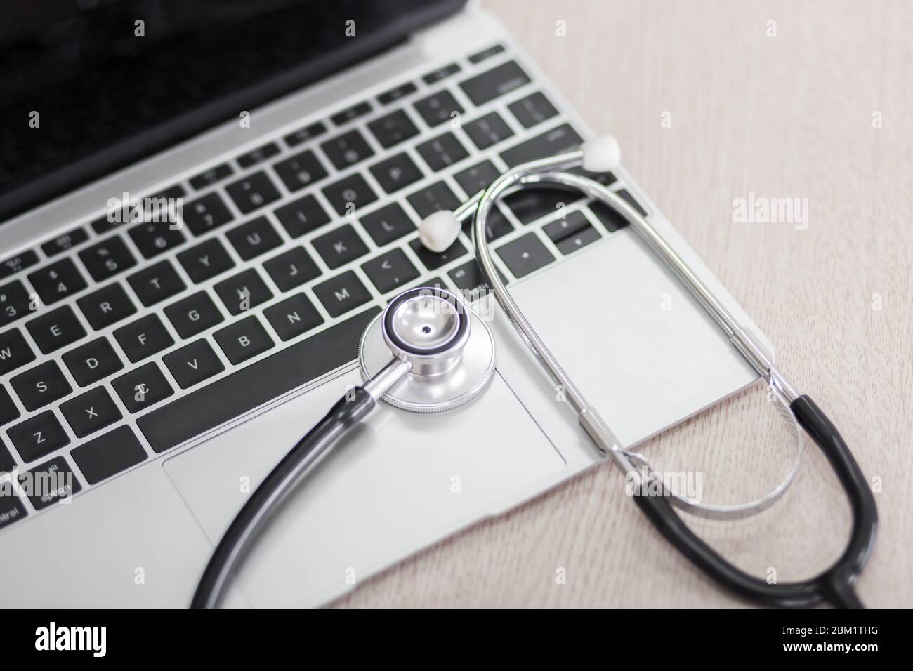 Stethoscope and laptop or computer on doctor desk prepare in hospital ...