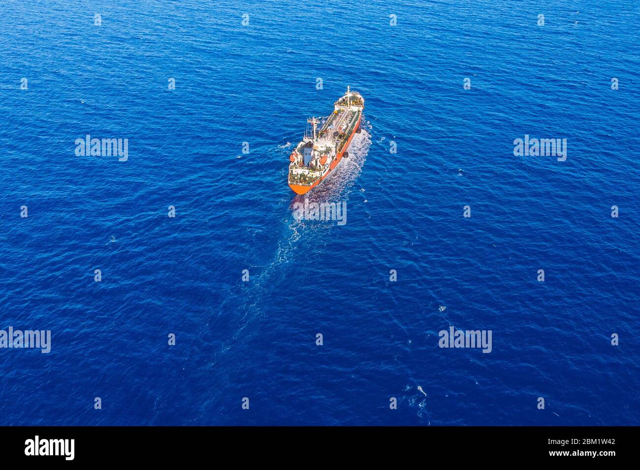 Oil ship chemical tanker sails blue sea. Aerial top view. Concept ...