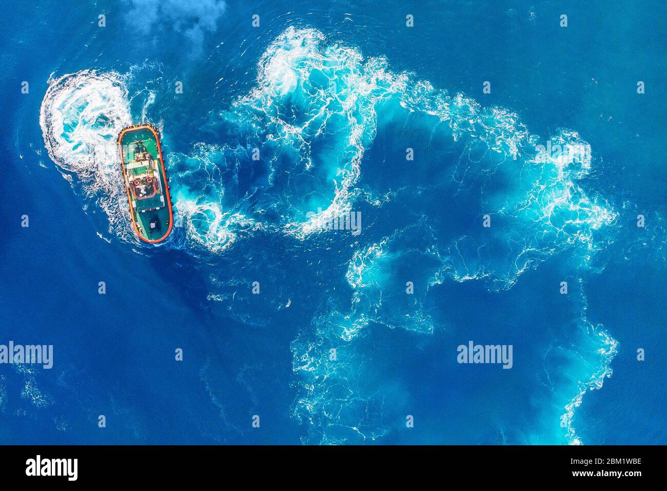 Tugboat blue sea port. Concept background business. Aerial top view ...
