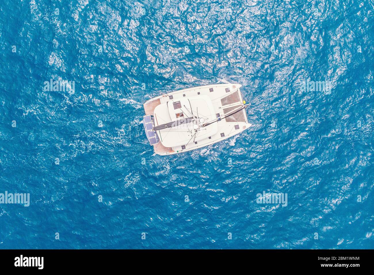 Top view white yacht catamaran stands blue sea water. Concept travel ...