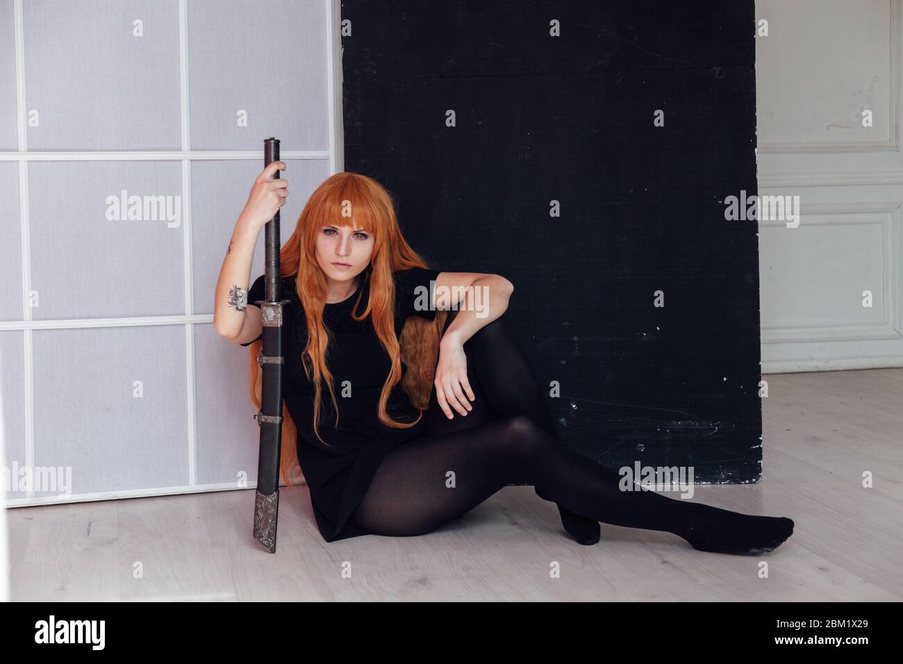 woman anime with red hair with Japanese samurai sword in dress Stock ...