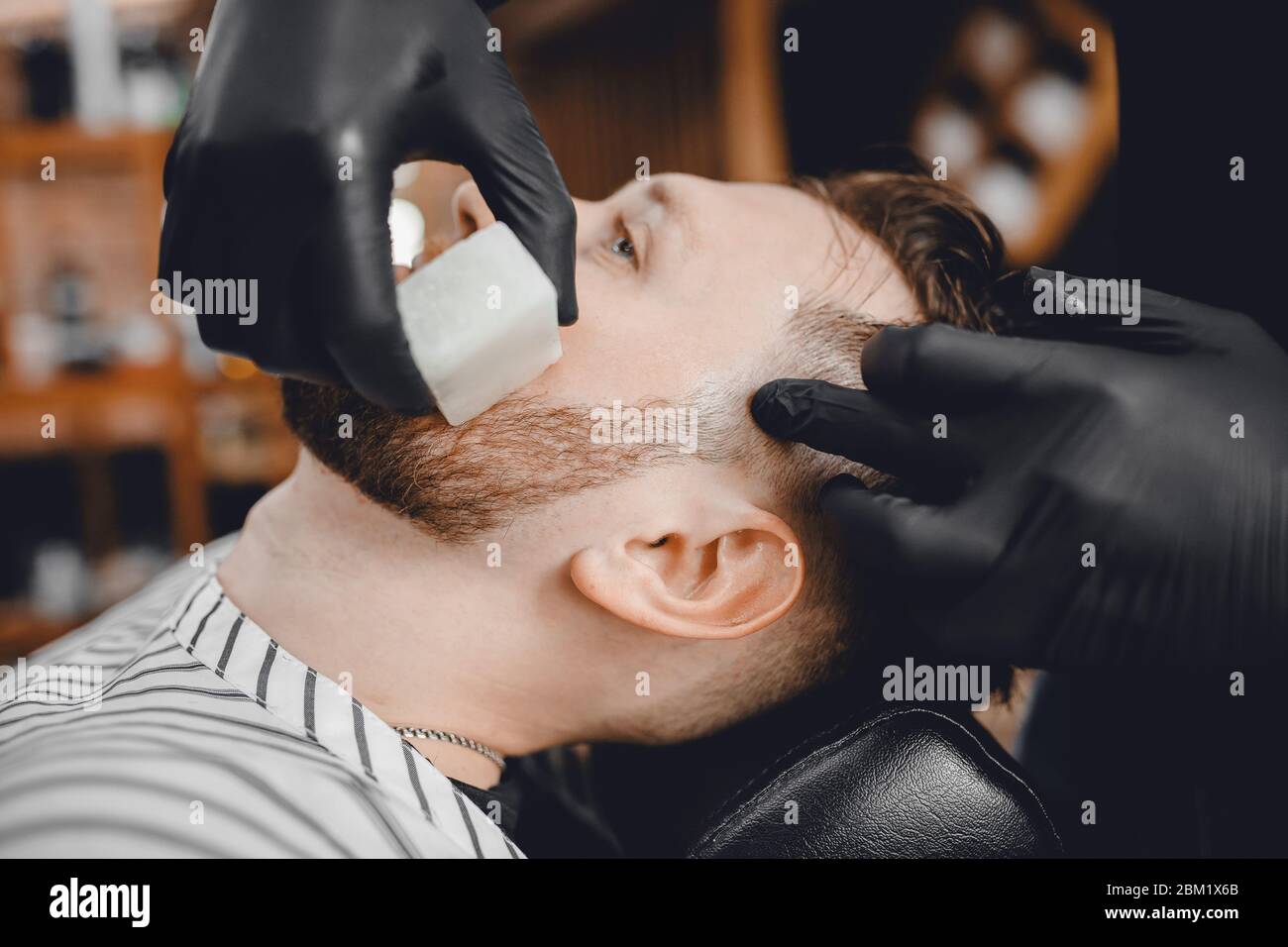 Barbershop. Hairdressers barber hair and beard with razor in salon ...