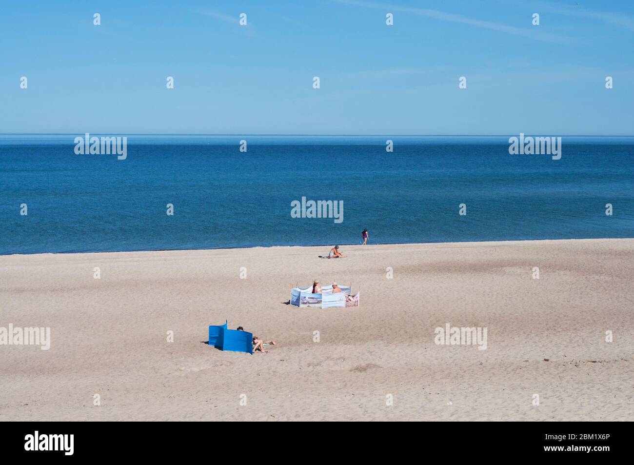 Old man sunbathing on beach hi-res stock photography and images - Alamy