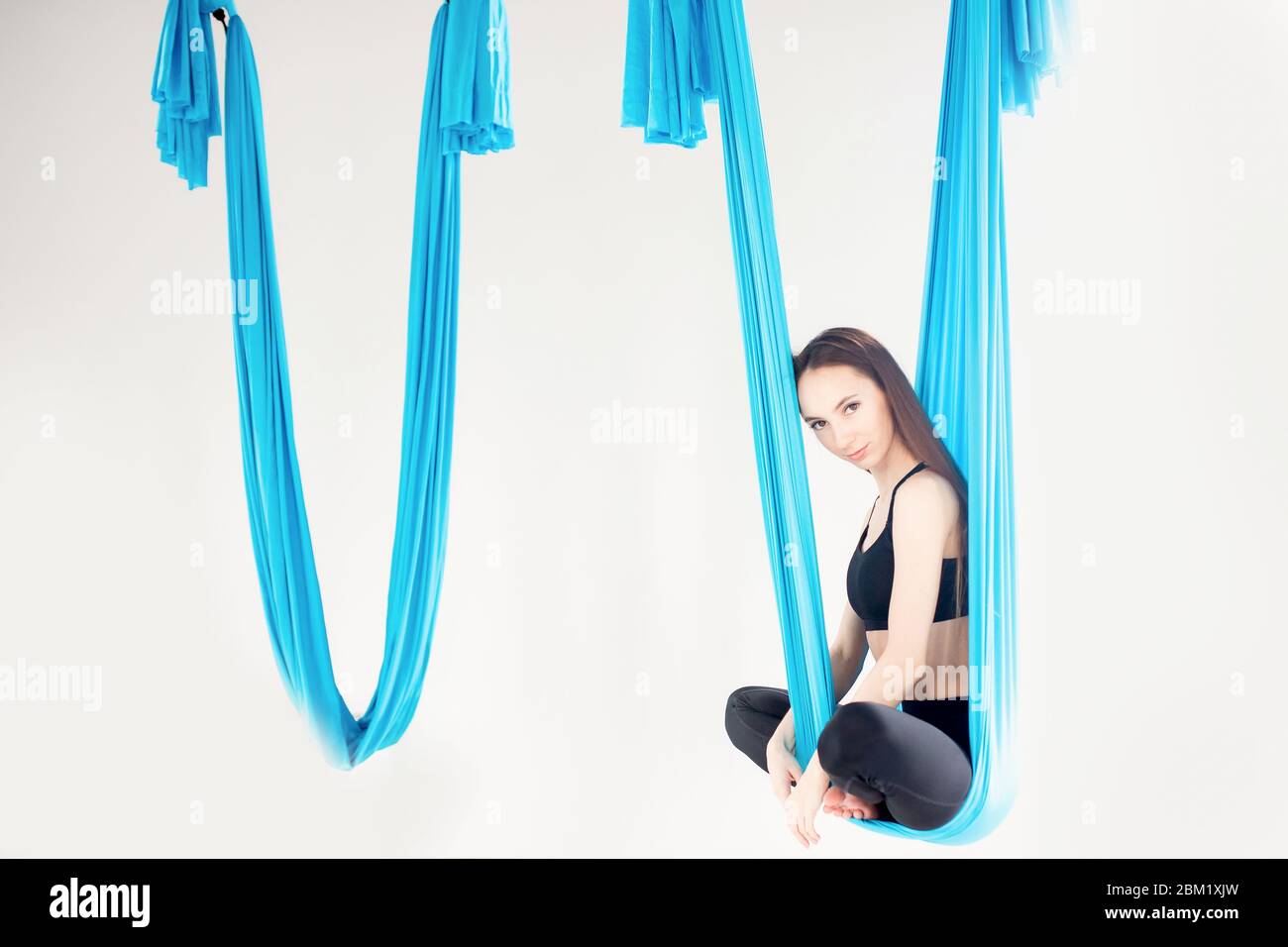 Aerial yoga stretching hi-res stock photography and images - Alamy