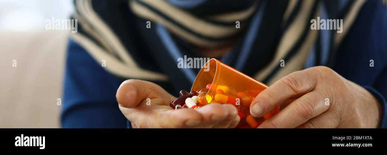Cold elderly woman falls asleep on palm capsule Stock Photo - Alamy