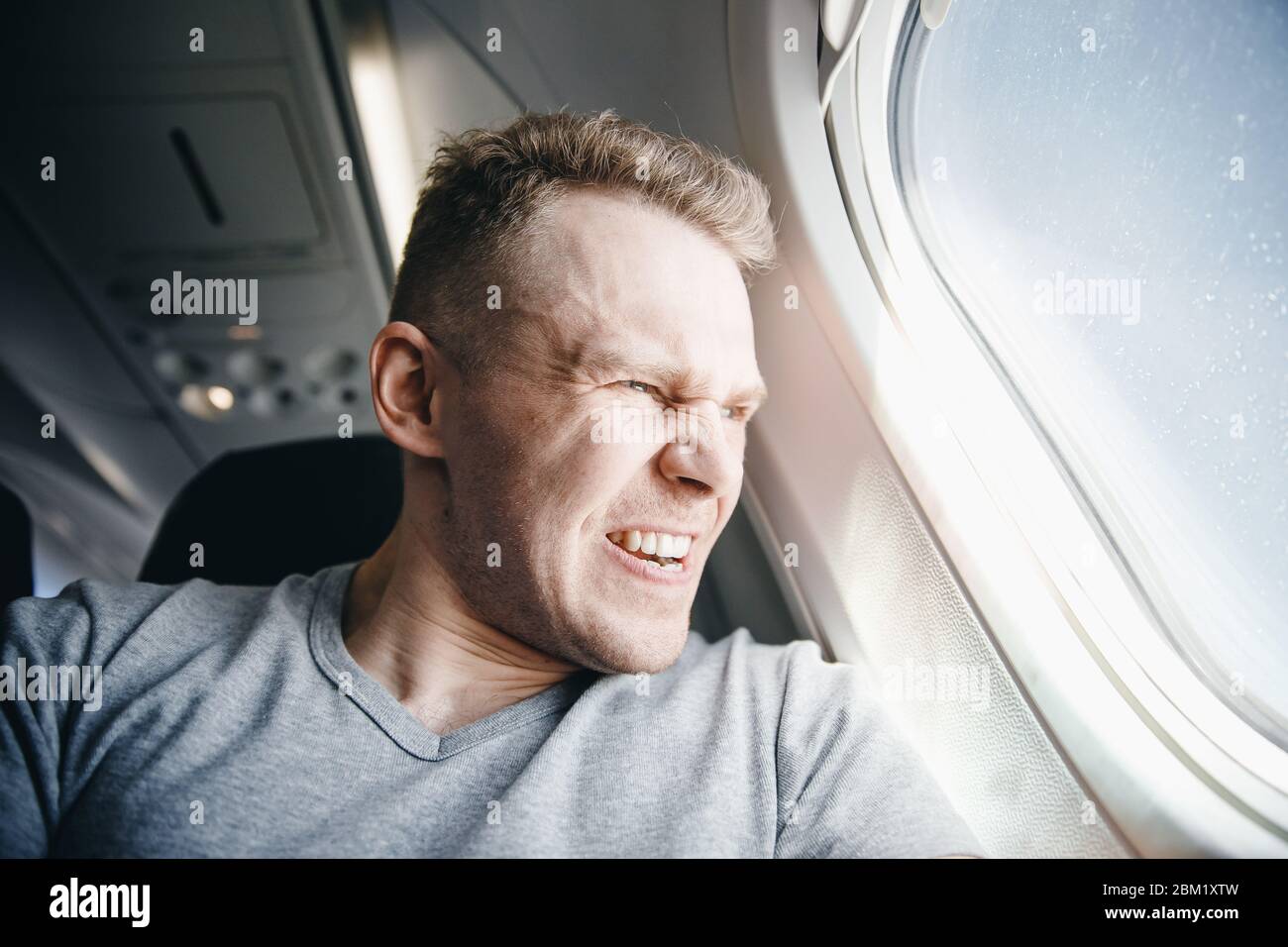 Man is angry in plane before departure. Concept aircraft delay Stock ...