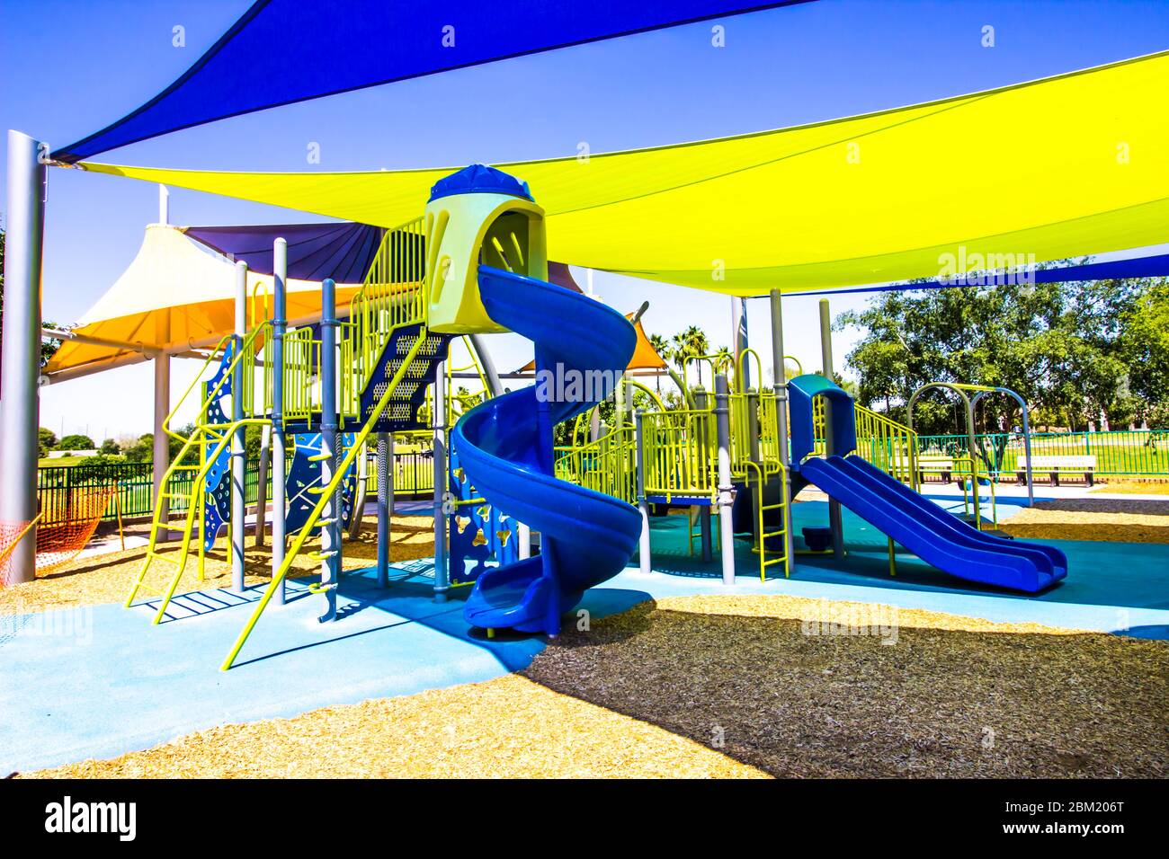 Kid's Playground Set With Multi Colored Canopy In Public Park Stock ...
