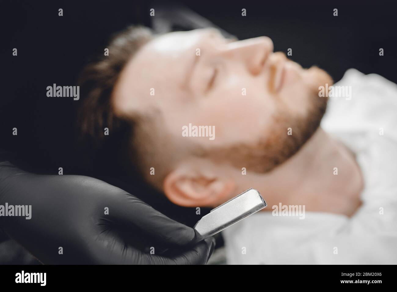 Barbershop. Hairdressers barber hair and beard with razor in salon ...