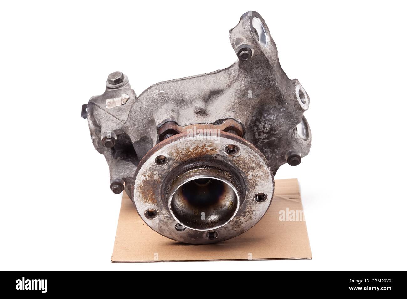 Close-up of a worn metal wheel hub with oil and rust elements on a ...