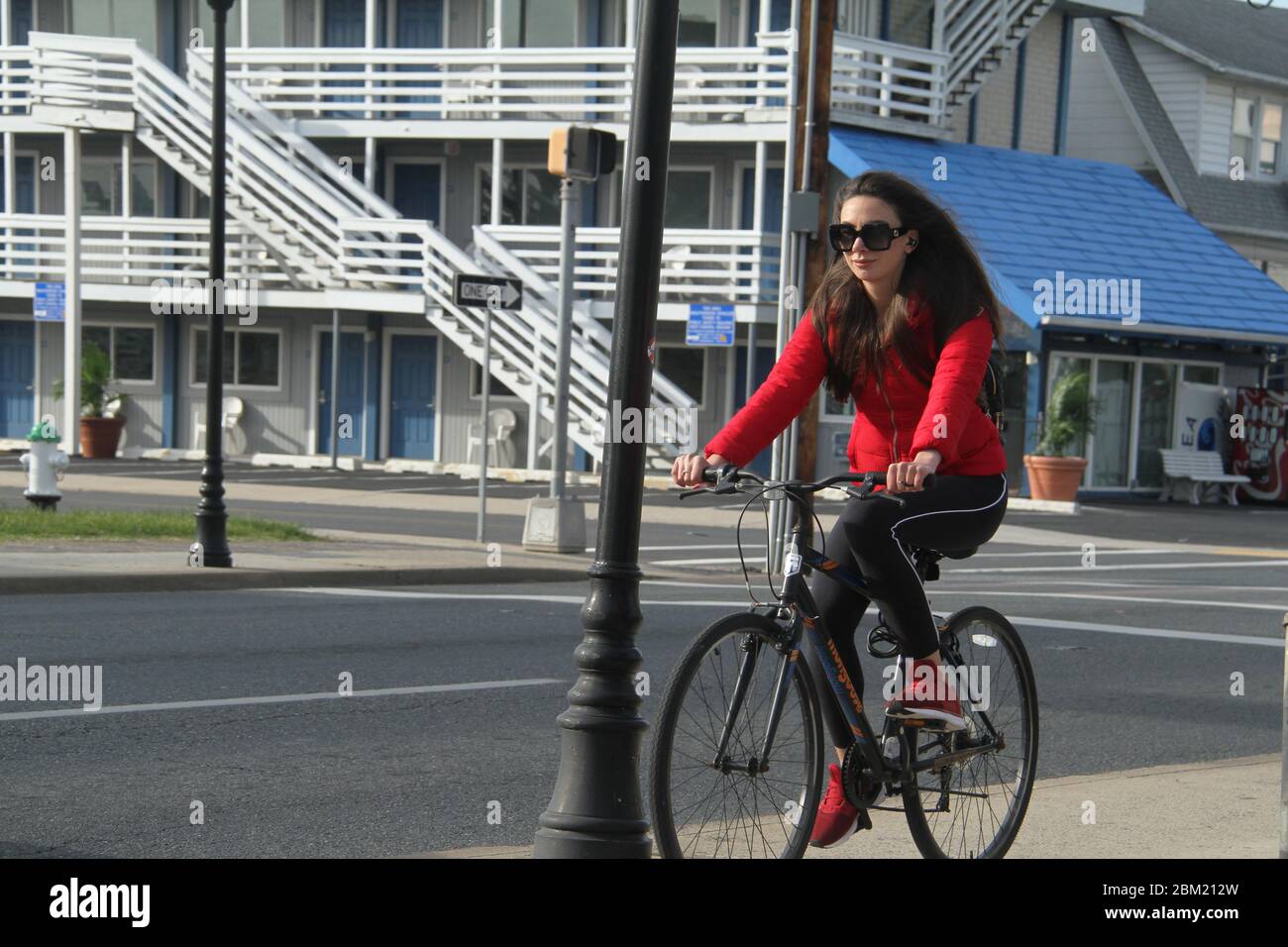 Riding bicycle with no helmet hi-res stock photography and images - Alamy