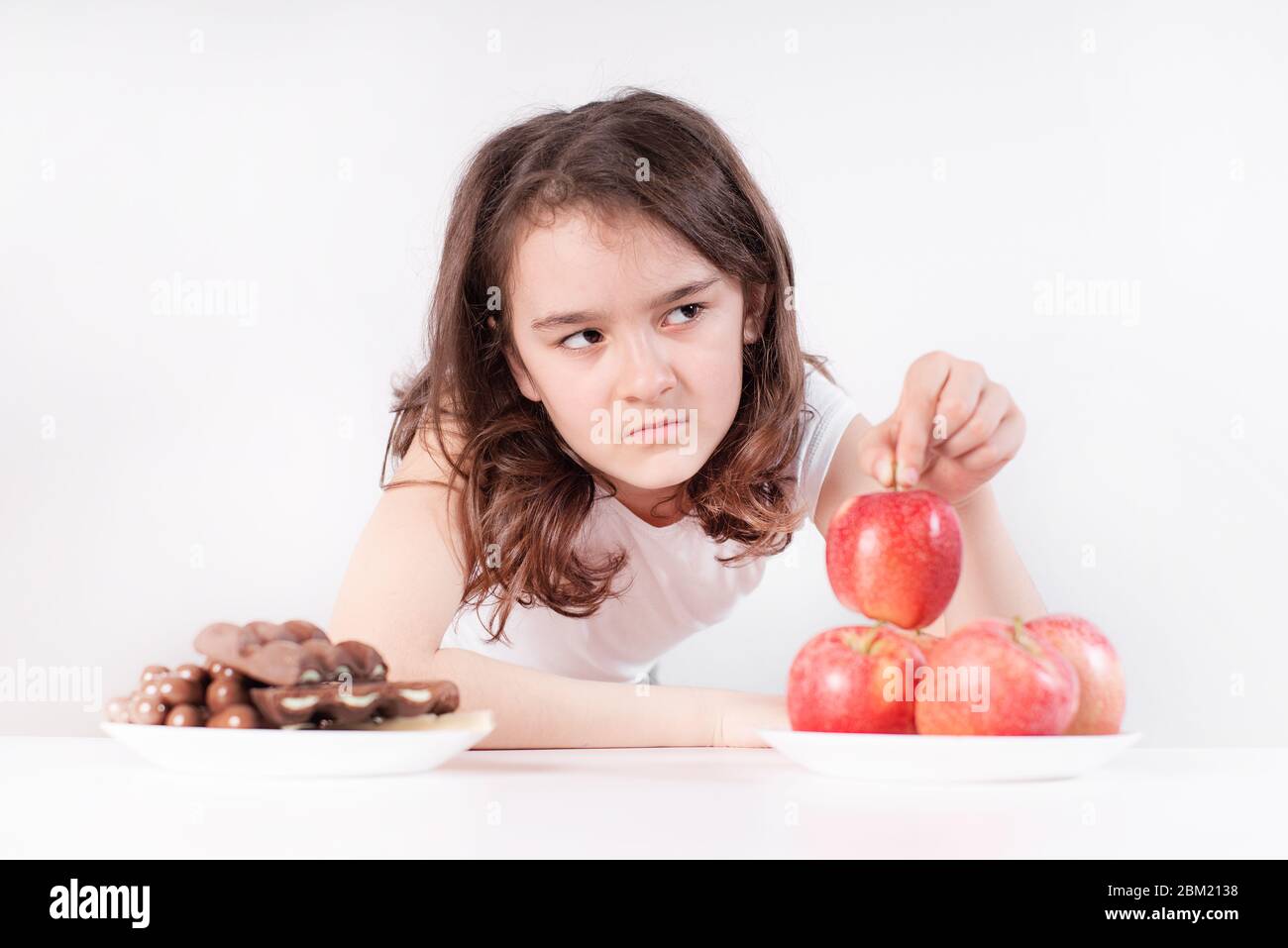Kid fruit candy thinking hi-res stock photography and images - Alamy