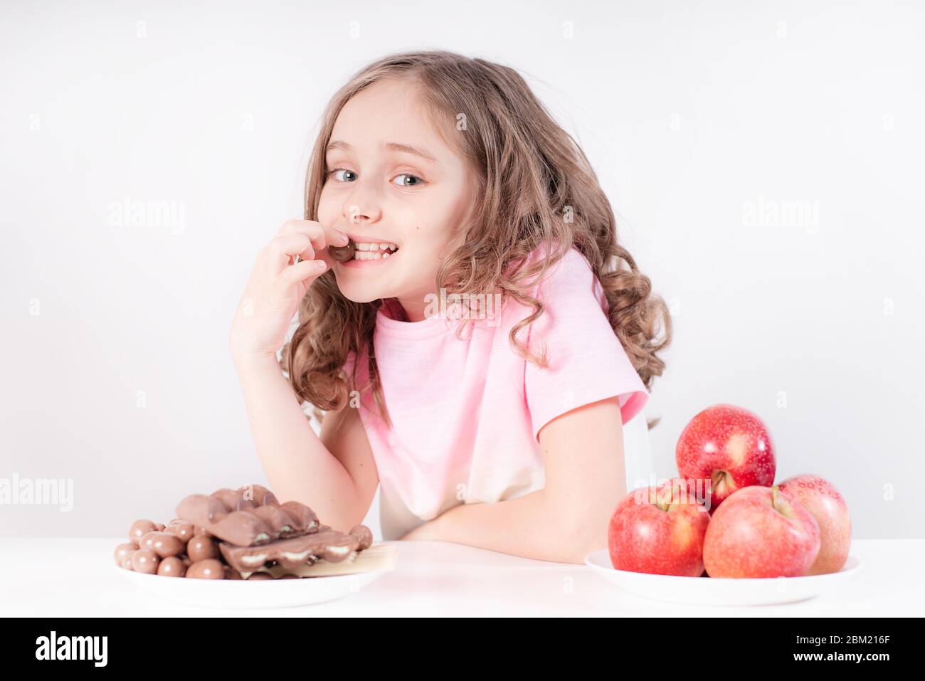 Kid fruit candy thinking hi-res stock photography and images - Alamy