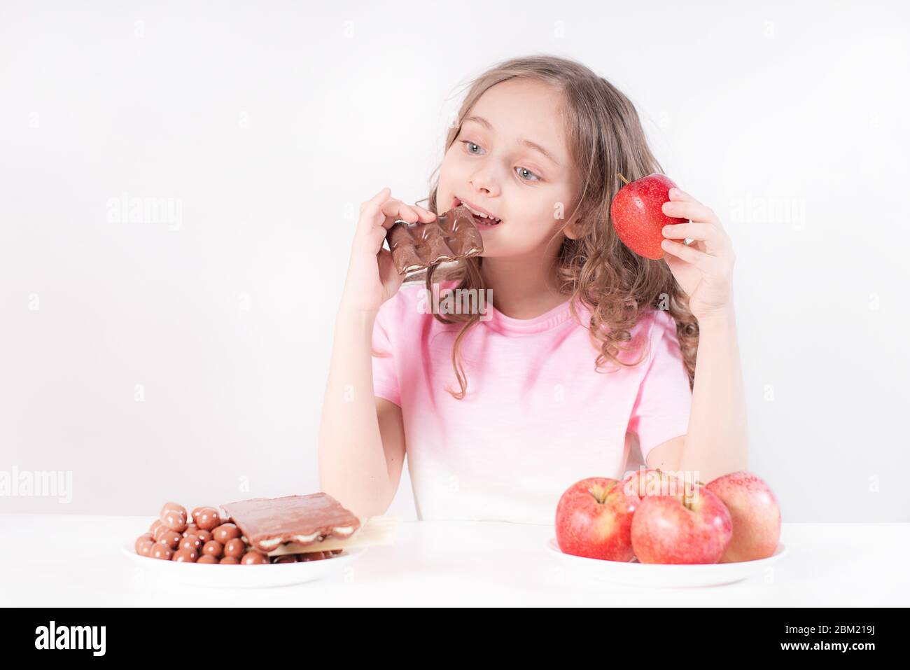 Kid fruit candy thinking hi-res stock photography and images - Alamy