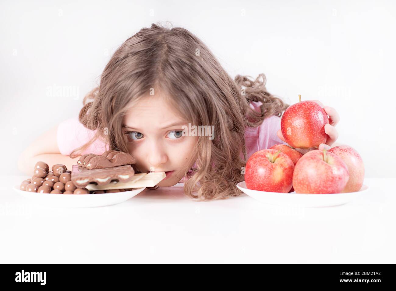 Kid fruit candy thinking hi-res stock photography and images - Alamy