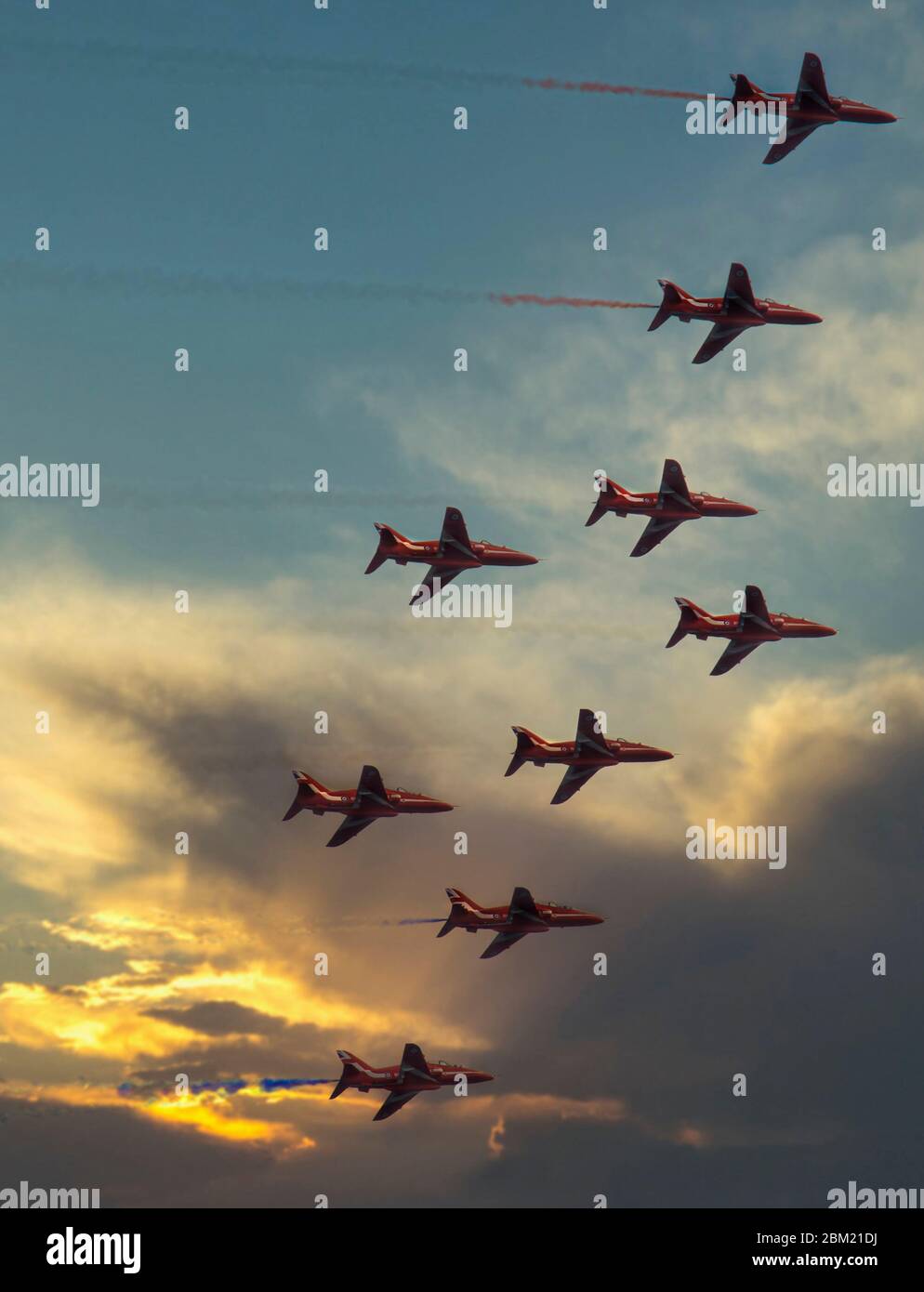 The British Red Arrows flying during sunset Stock Photo - Alamy