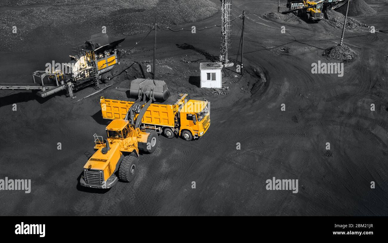 Open pit mine, coal loading in trucks, transportation and logistics ...