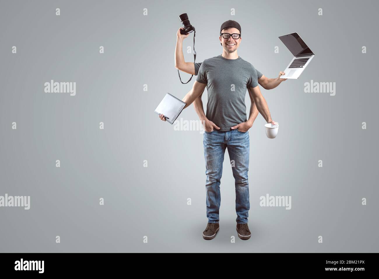 Funny media guy with multiple arms and equipment Stock Photo - Alamy