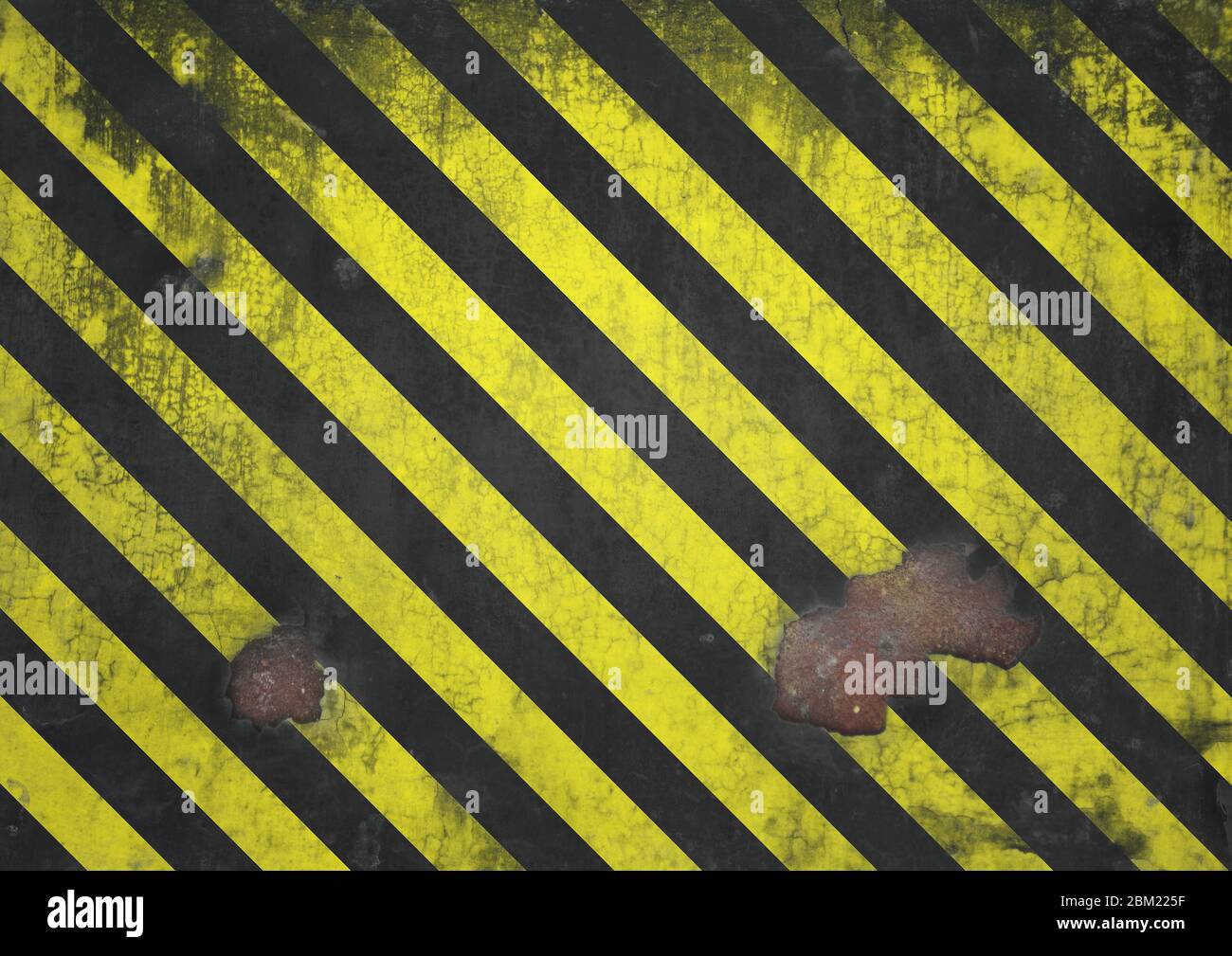A distressed, corroded and rusty black and yellow metal effect hazard ...