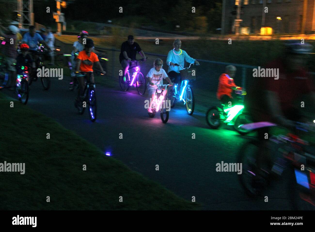 Lynchburg, VA, USA. People with bikes decorated for the Glow Ride event ...