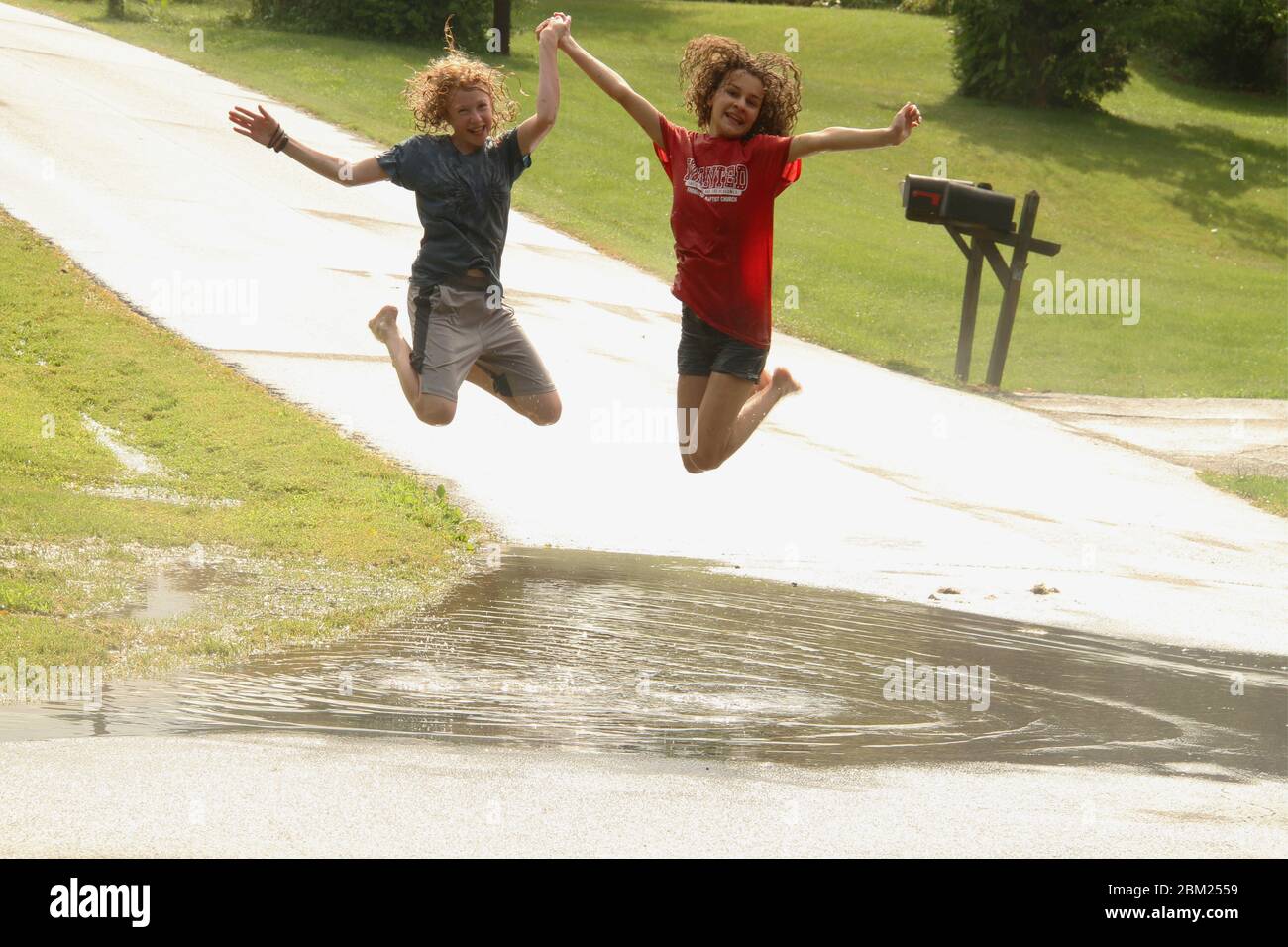 Jump in muddy puddles hi-res stock photography and images - Alamy