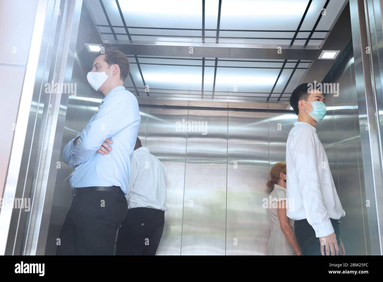 Social distancing in elevators coronavirus outbreak people stay in ...