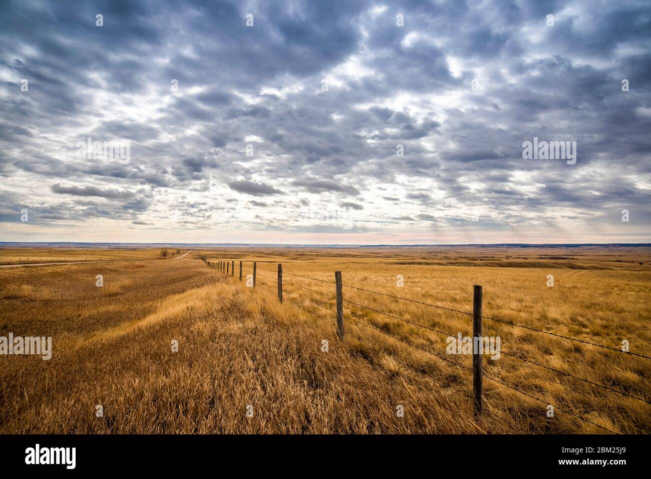 Lonely highway and fence line on the plains of western Nebraska, USA ...