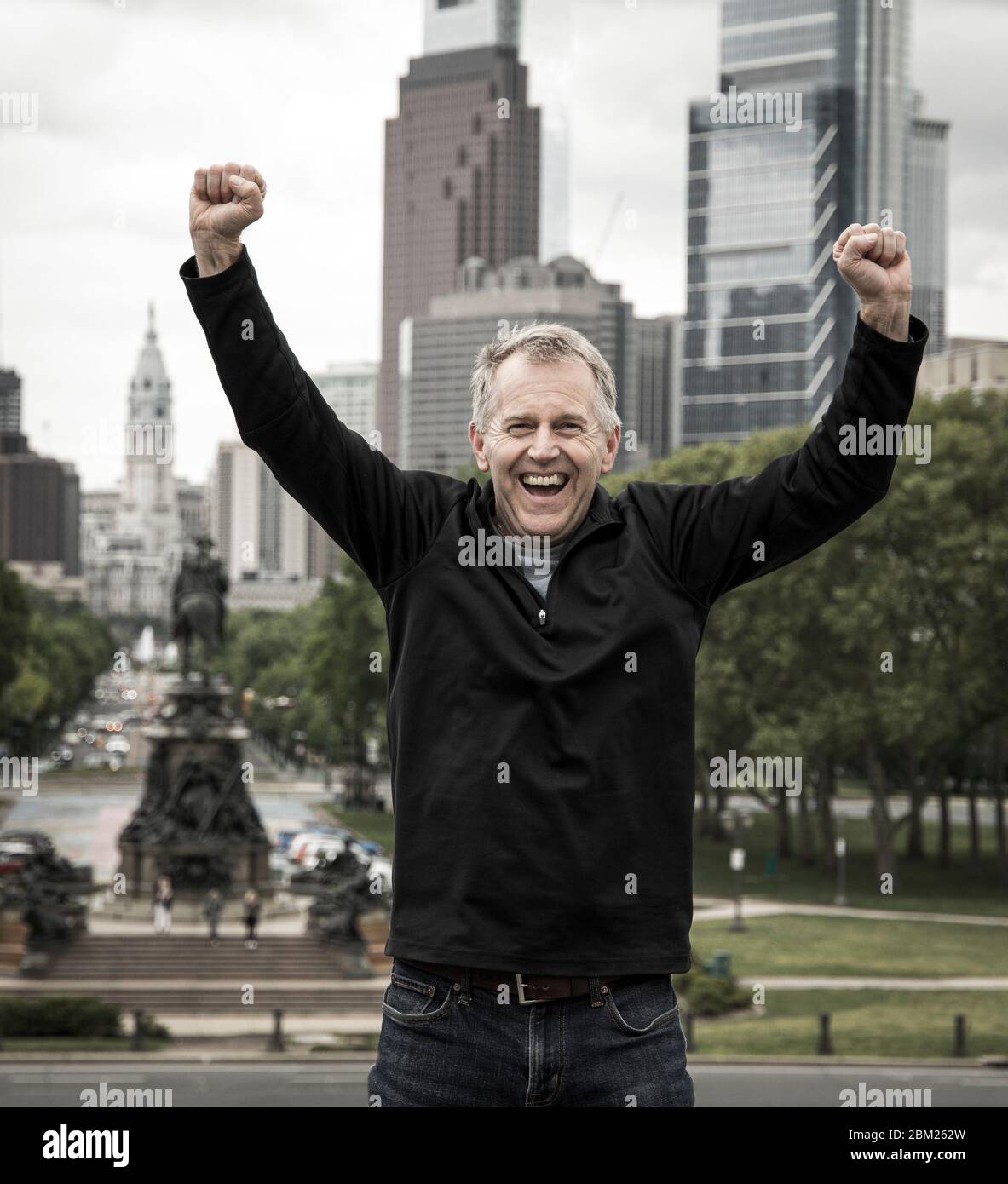 Celebrating like Rocky at the top of the iconic steps that lead up to ...