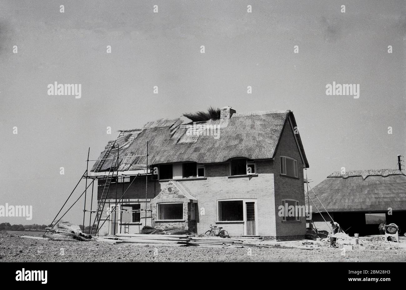 1960s, historical, a new two-storey house being built in the ...