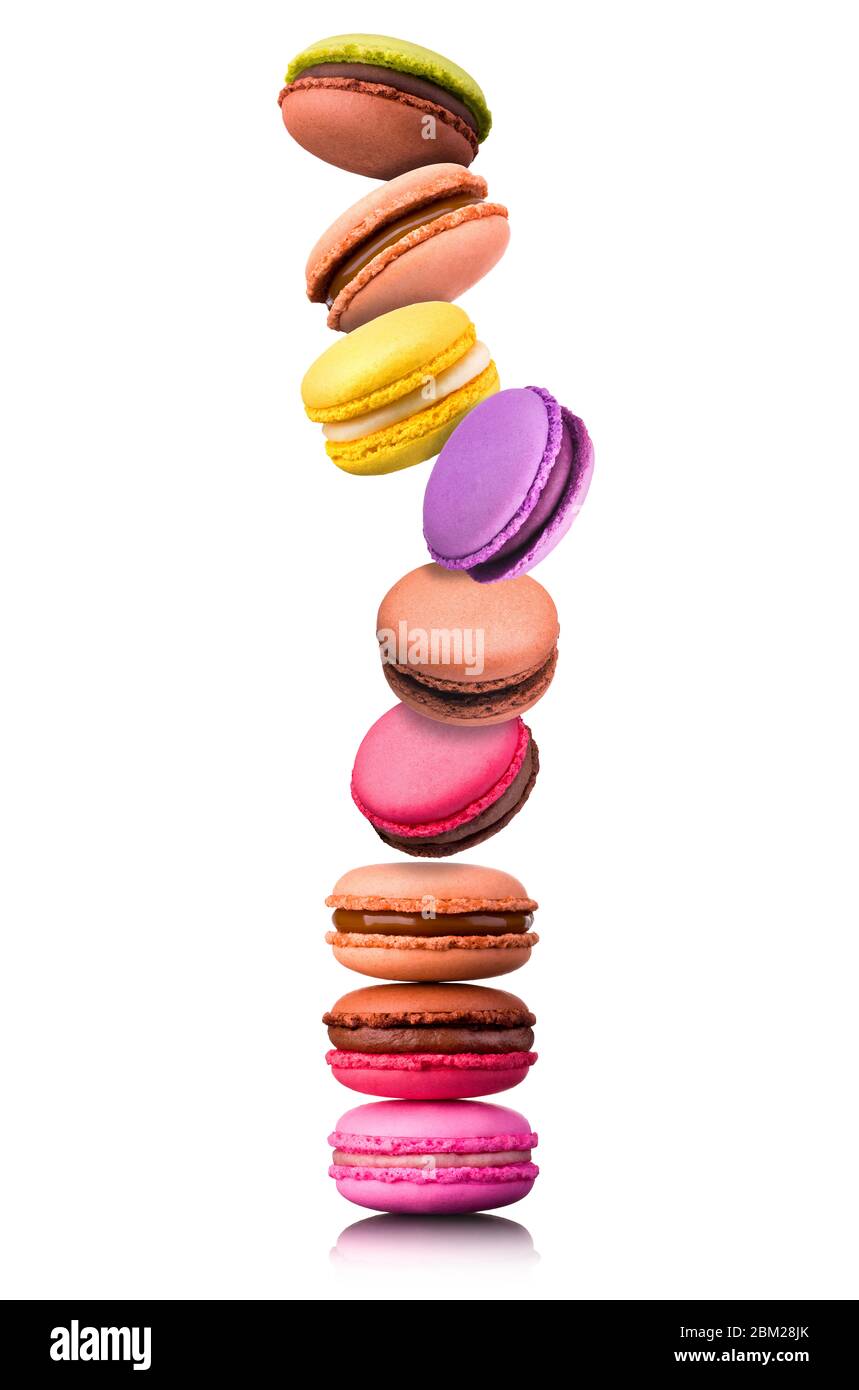 Set of flying french colorful macaroons isolated on white background ...