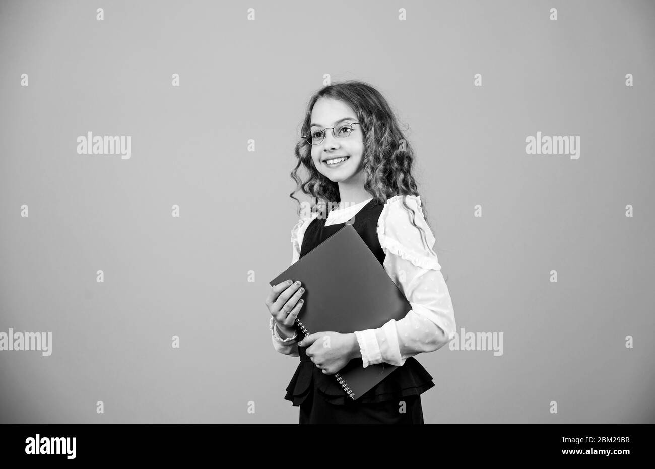 Girl hold textbook folder test. Preparing to exams in library. Small ...