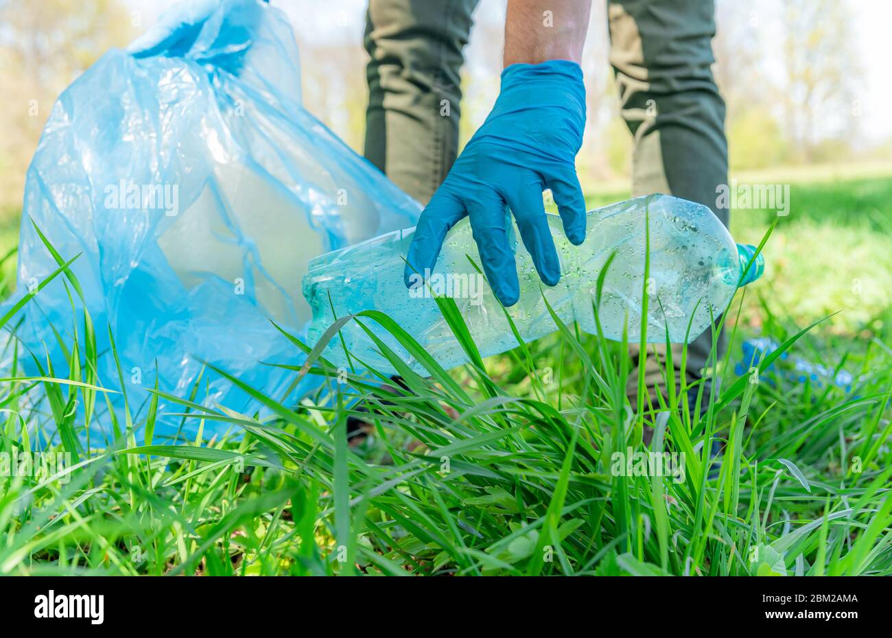 help the ecology of the planet by collecting garbage in nature Stock ...